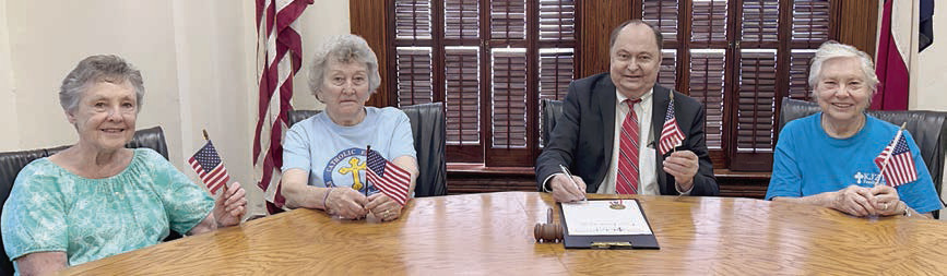 County judge signs proclamation designating June 14 as National Flag ...